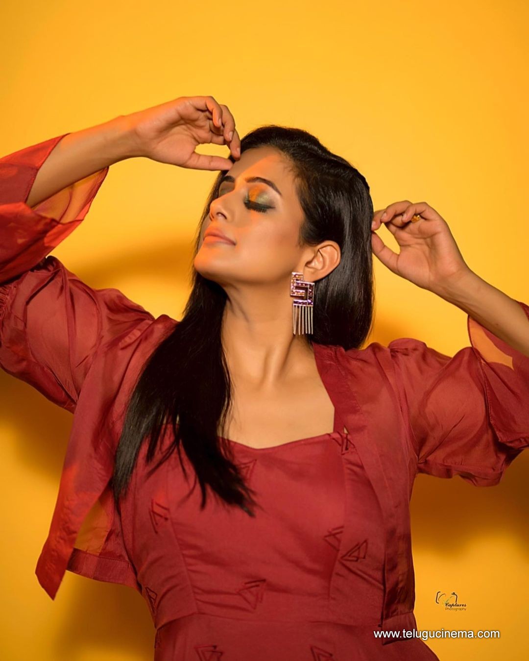 Priyamani in a red gown
