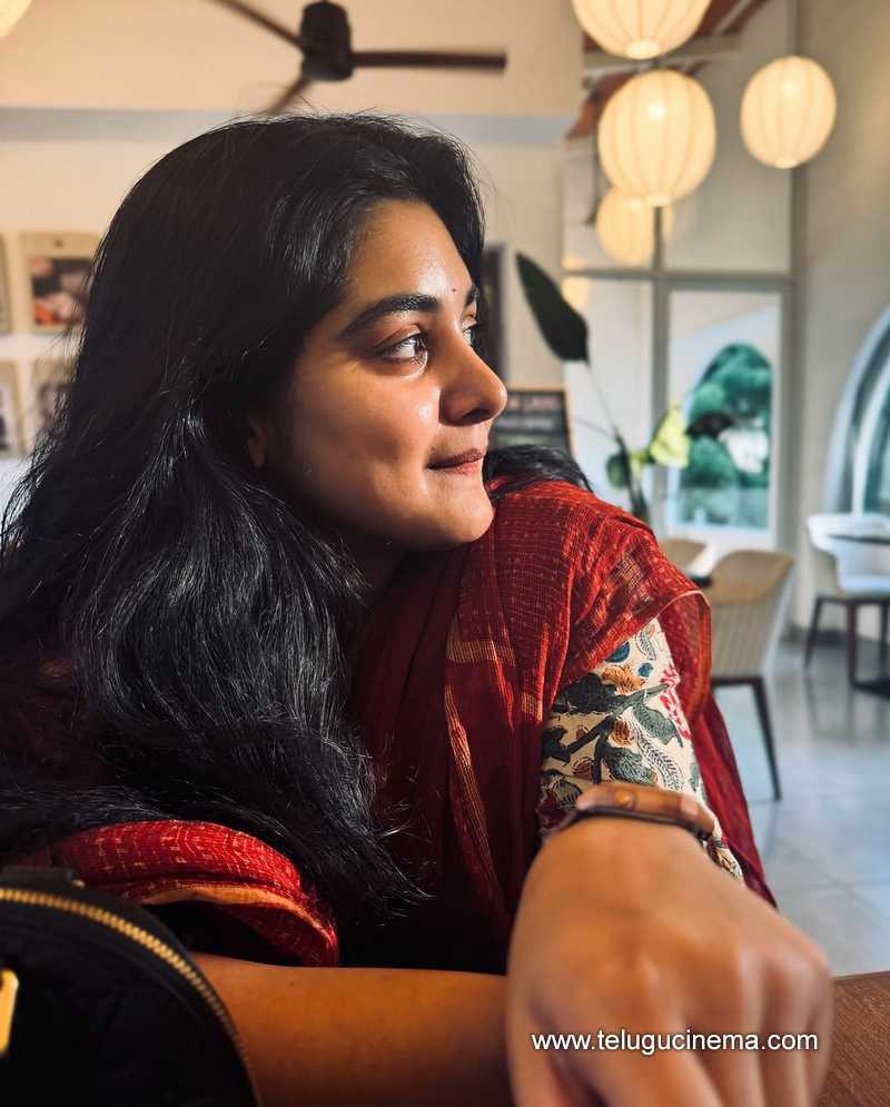 Nivetha Thomas poses smiling